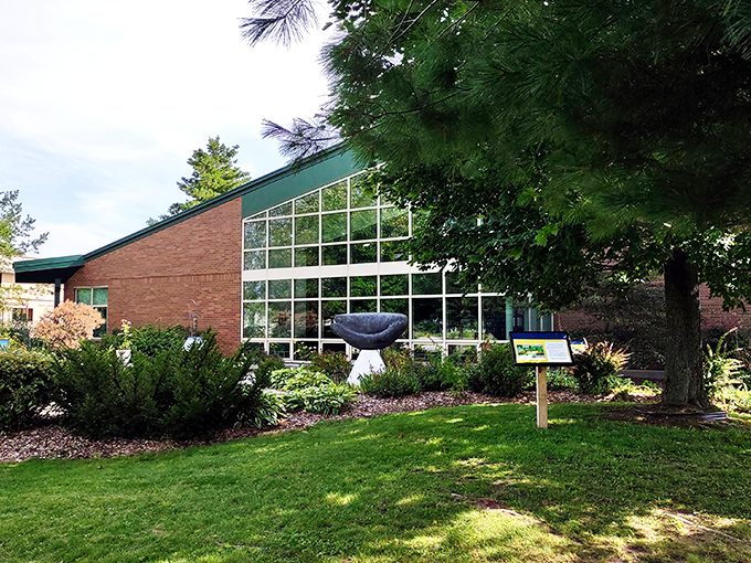 Modern architecture meets community purpose at Escanaba's library, where floor-to-ceiling windows invite natural light and literary adventures in equal measure.