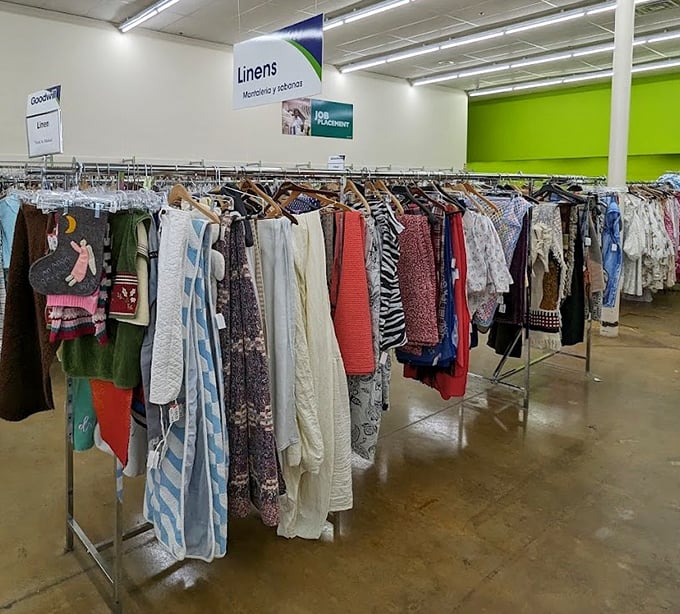 The linens section: a fabric rainbow where vintage bedspreads and modern throws create an unexpected textile museum of American home fashion.