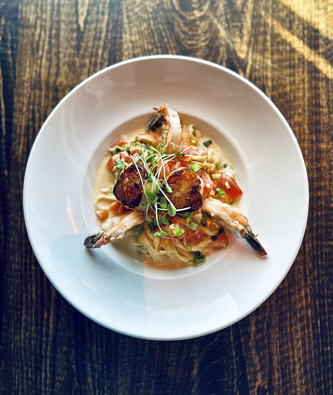 This isn't just pasta&mdash;it's a seafood symphony where plump shrimp and scallops perform a delicious ballet in creamy sauce.