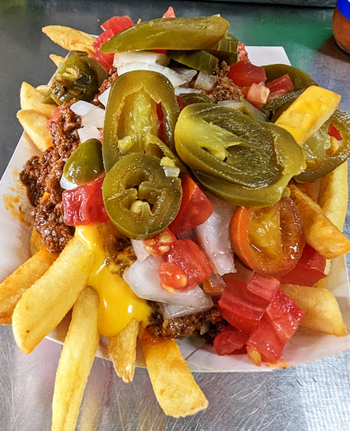 Loaded fries that blur the line between side dish and main event. The jalapeños aren't just garnish—they're essential supporting actors.