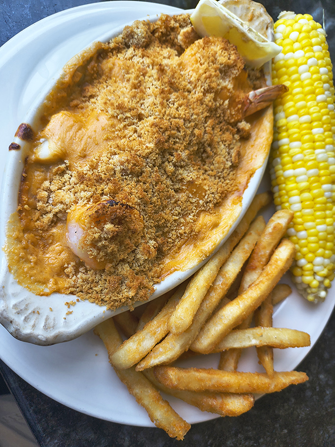 Lobster pie with golden crumb topping and fries&mdash;comfort food that went to graduate school and came back sophisticated yet approachable.