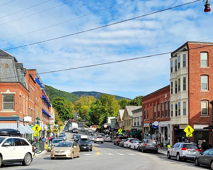 Main Street's gentle curve reveals mountains beyond storefronts&mdash;a reminder that in Camden, wilderness and civilization are perfect neighbors.