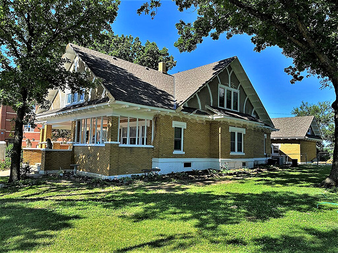 This handsome Craftsman bungalow represents the architectural pride of Augusta's early prosperity&mdash;solid brick foundations for generations of Kansas dreams. 
