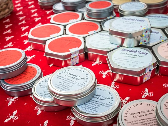 Heartland Honey's balms and lotions lined up like tiny soldiers of self-care. Bees make honey, humans make magic.