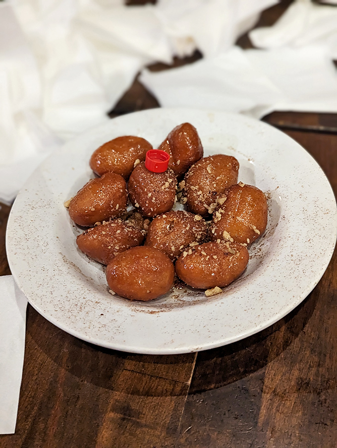 Loukoumades&mdash;Greek doughnut holes that make your neighborhood donut shop weep with inadequacy. Honey-soaked, cinnamon-dusted pillows of pure joy.