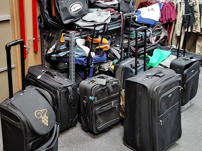 The luggage corner: where your travel dreams meet practical reality, and someone else's abandoned vacation plans become your next adventure's companion.