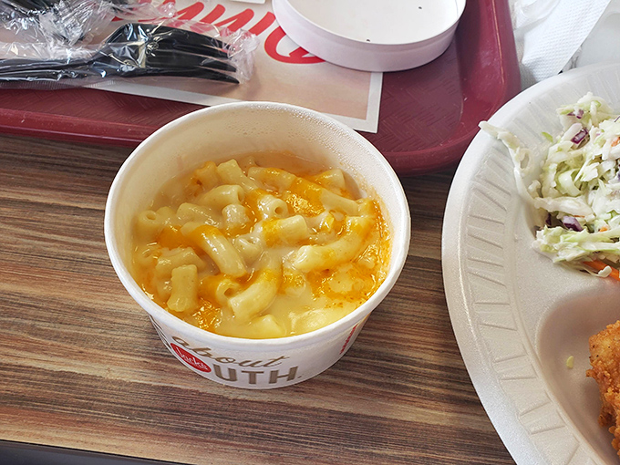 Mac and cheese that doesn't apologize for being exactly what it is &ndash; comfort in a cup, with that signature Southern orange glow.