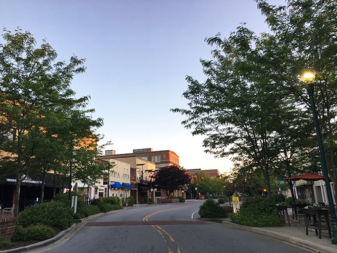 Main Street at dusk transforms into a Norman Rockwell painting come to life, where the pace slows enough to remember what matters.