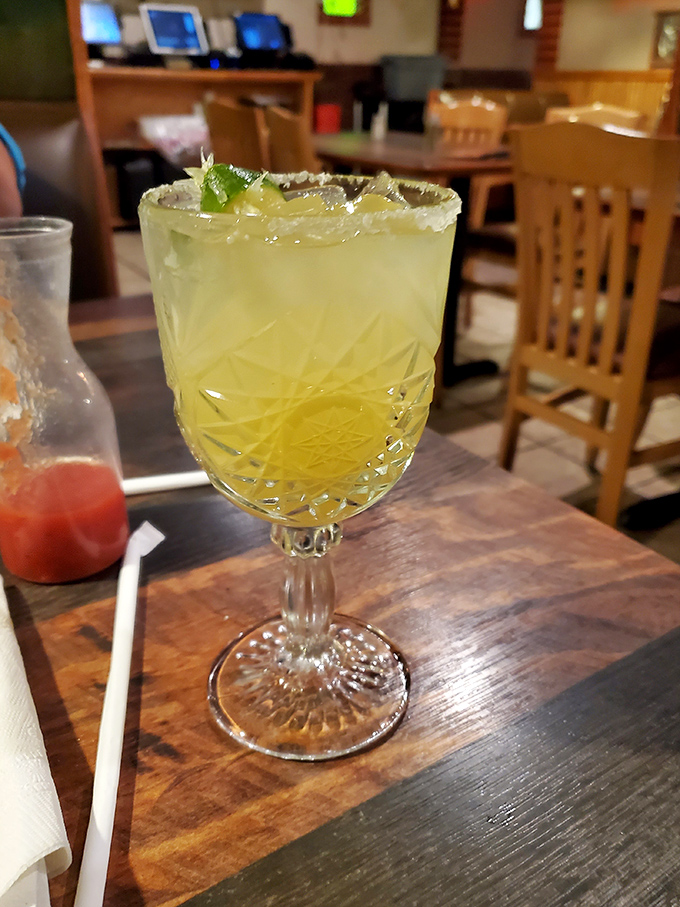 A proper margarita in a proper glass&mdash;salt rim catching the light like diamonds. Liquid sunshine with a kick that makes small talk easier. 