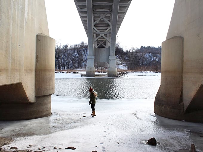 Beneath the Mendota Bridge, winter creates an otherworldly landscape where river, ice, and massive concrete pillars converge in a scene straight from a Coen brothers film. 
