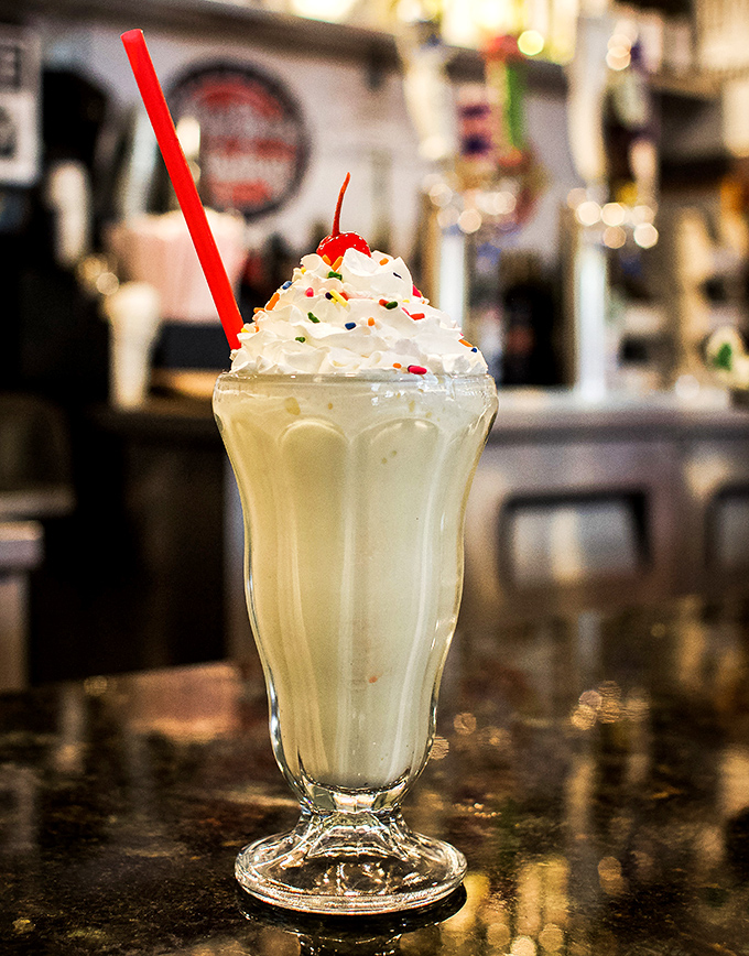 This isn't just a milkshake&mdash;it's a frothy skyscraper of vanilla bliss topped with whipped cream, sprinkles, and childhood memories in liquid form.