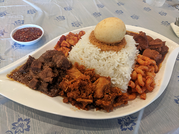 A feast fit for royalty &ndash; rice mountain at the center, surrounded by a moat of savory meats and an egg crown.