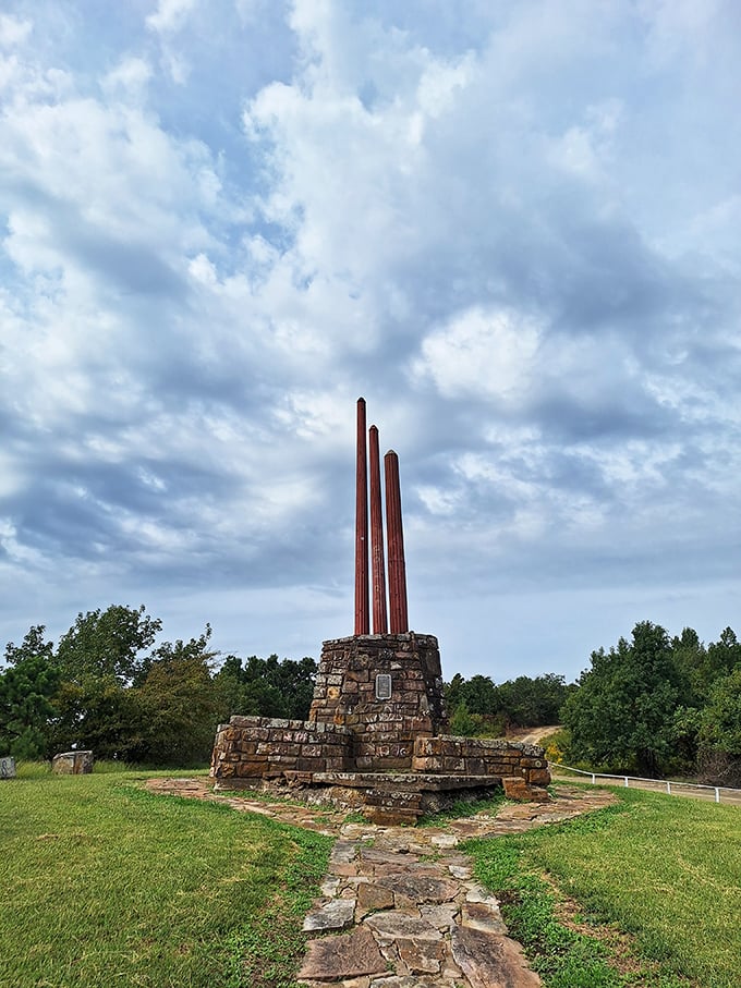 Three pillars reaching skyward, telling stories of the past. History stands tall against Oklahoma's impossibly blue sky.
