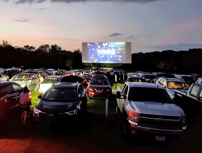 When darkness falls, the real show begins. Cars glow with dashboard lights while stories unfold larger than life against the Tennessee night. 