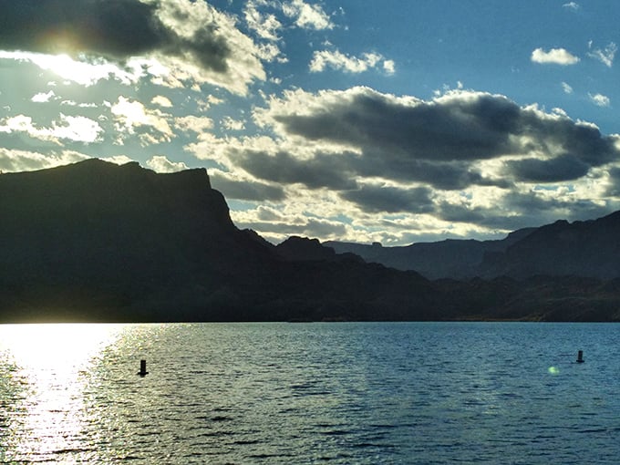 Sunset transforms the cove into a masterpiece of light and shadow. Even the clouds seem to pause their journey to admire the view. 