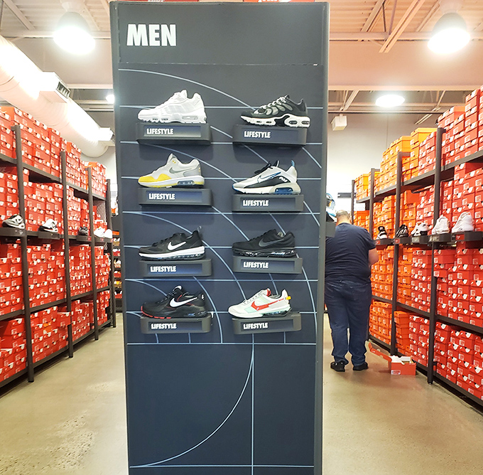 The Nike wall of dreams where athletic shoes are organized by lifestyle category, making "I need new sneakers" sound almost philosophical and deeply personal.