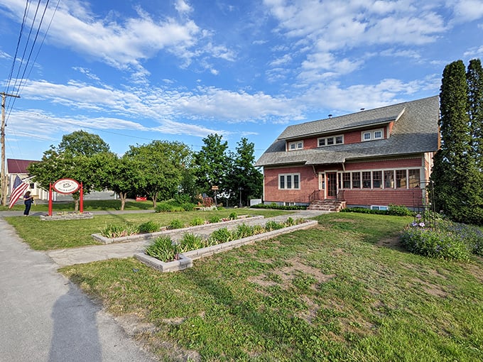 This charming red house with its welcoming porch practically whispers "come in and stay awhile"&mdash;quintessential Maine hospitality in architectural form.