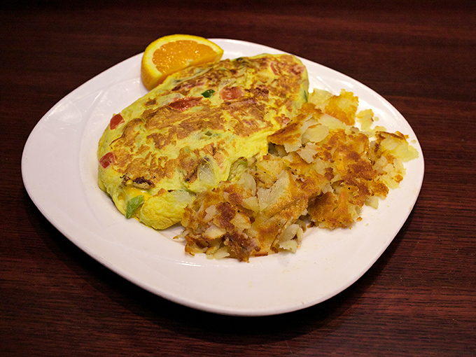 This omelet didn't just bring its A-game; it brought the whole alphabet of flavor, with hash browns playing delicious backup.