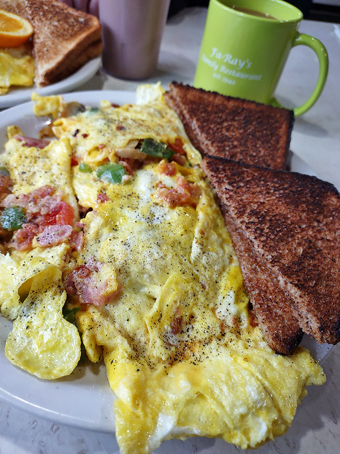 This isn't just an omelet&mdash;it's a colorful canvas of breakfast possibilities, with each bite delivering a different combination of flavors.