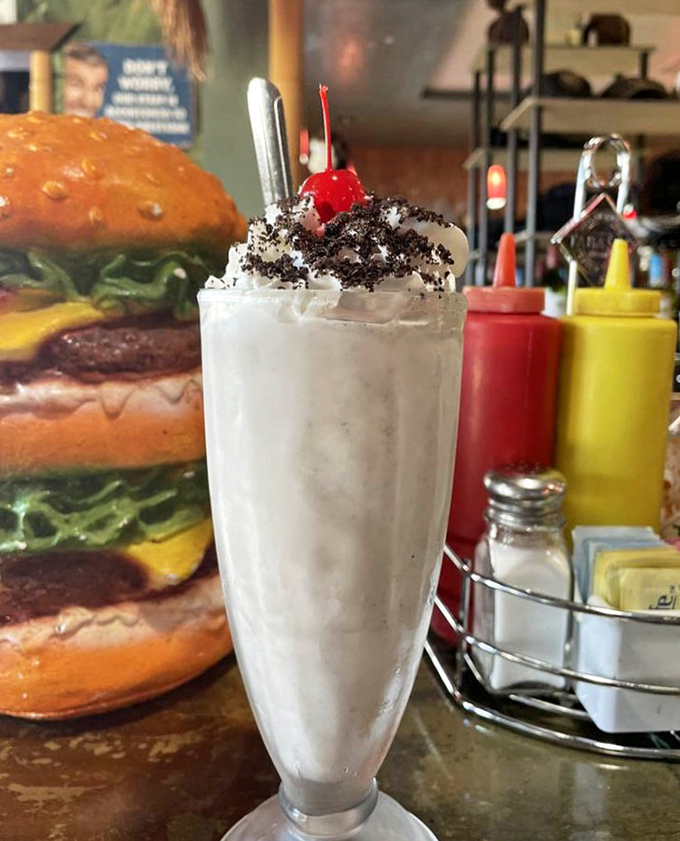 An Oreo milkshake topped with cookies and a cherry, because sometimes more is definitely more, always.