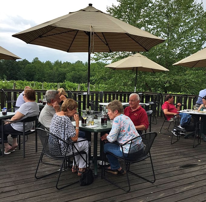 The outdoor deck offers front-row seats to vineyard views&mdash;where conversations flow as freely as the wine being poured.