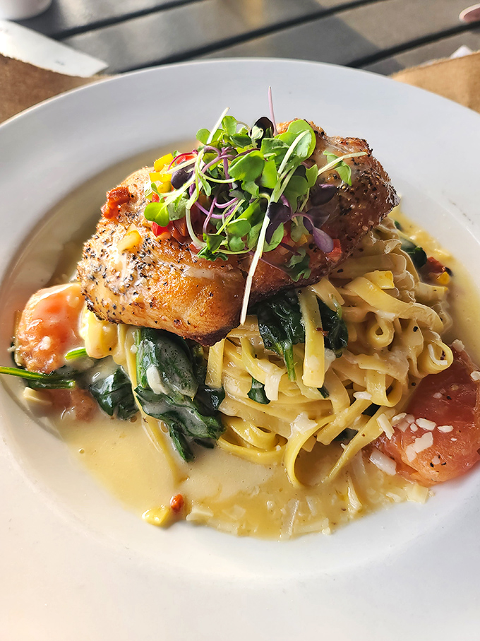 This pan-seared snapper perched atop pasta isn't just dinner &ndash; it's edible architecture with layers of flavor in every forkful.