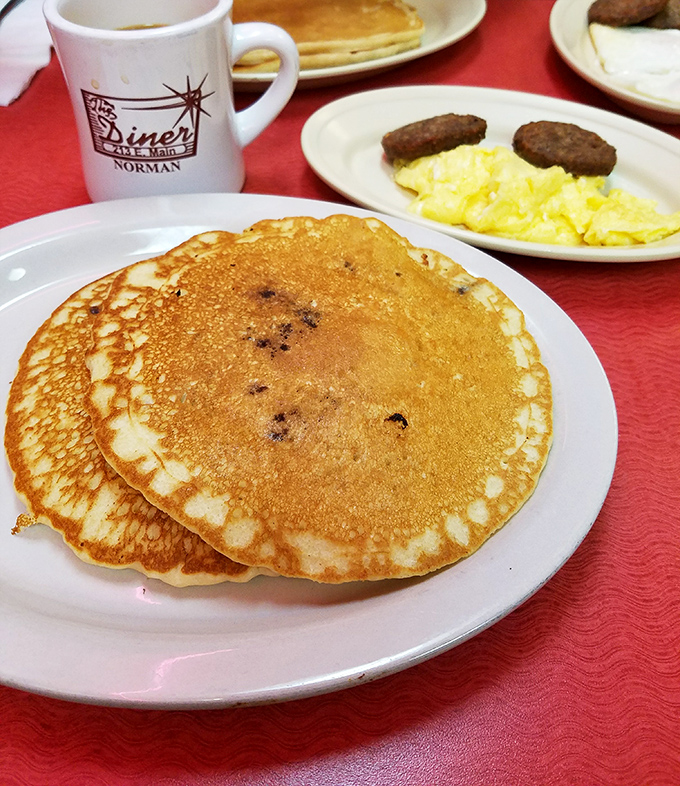 Golden pancakes with the perfect circumference—not too thick, not too thin—waiting patiently for their maple syrup baptism.