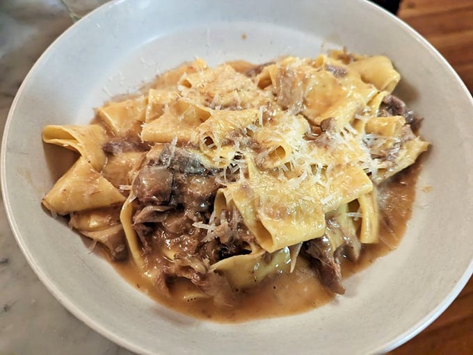 Wide ribbons of pappardelle embracing braised meat like long-lost friends at a reunion. Comfort food that speaks fluent Italian.