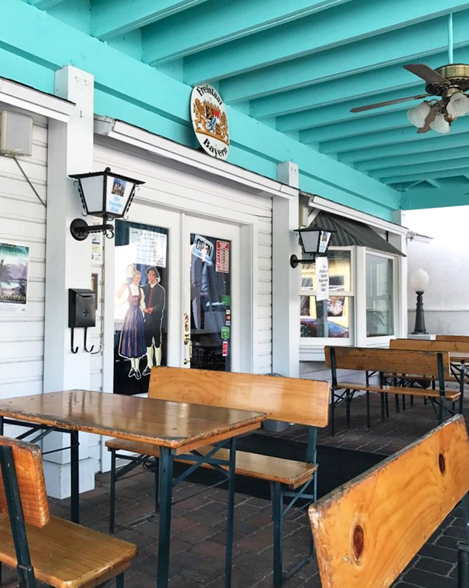 The outdoor beer garden seating brings authentic Bavarian dining al fresco to sunny Florida, complete with traditional bench tables.