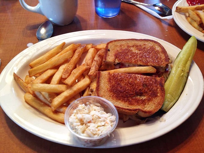 The sandwich that launched a thousand naps. Golden-grilled bread, melty cheese, and that pickle standing guard like a crunchy sentinel.