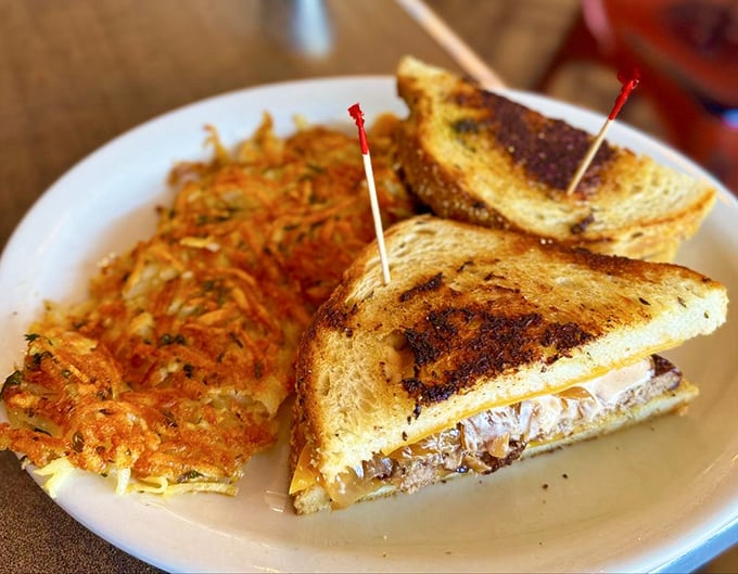Golden-brown perfection meets crispy hash browns. This sandwich isn't just grilled&mdash;it's been transformed into something your childhood dreams were made of.