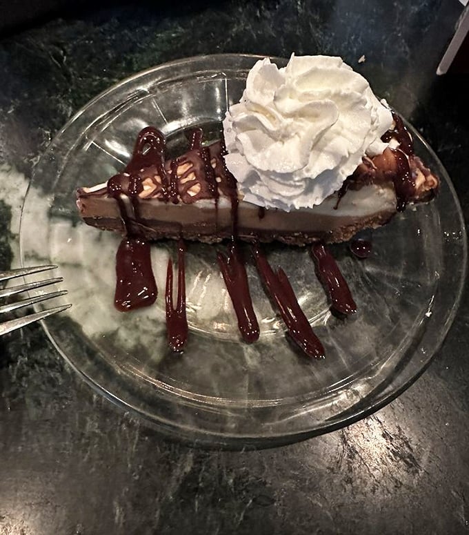 A slice of chocolate peanut butter pie that makes you wonder why you ever wasted calories on lesser desserts.