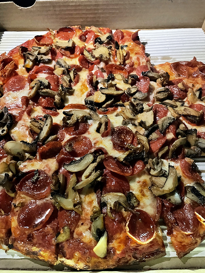 The classic pepperoni-mushroom combo &ndash; proof that sometimes the simplest partnerships create the most memorable symphonies. Those crispy edges are calling your name.