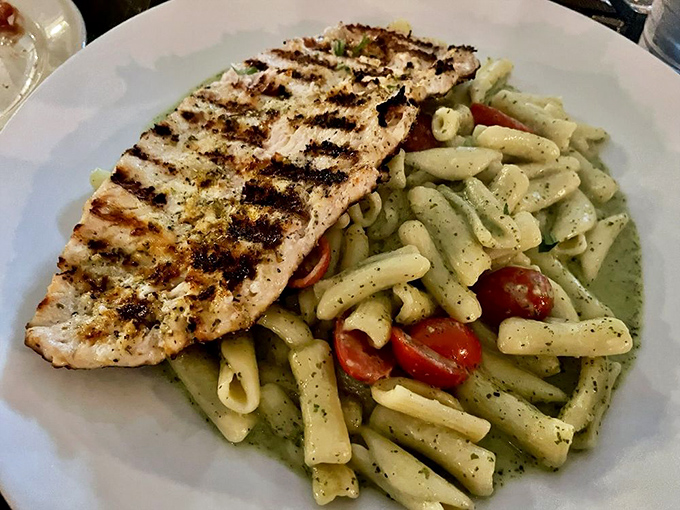 Pesto pasta with grilled chicken&mdash;where herbaceous green sauce meets perfectly charred protein in a dish that screams "vacation in Liguria."