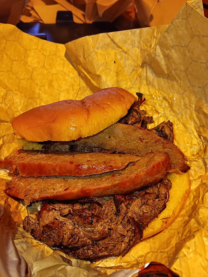 Architecture that matters! This towering creation of thinly-sliced beef and condiments demonstrates why structural integrity is crucial in sandwich engineering.