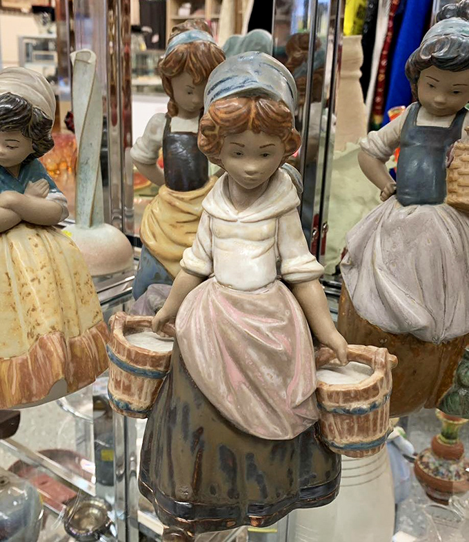 Delicate porcelain figurines frozen in eternal chores&mdash;tiny time capsules from grandmother's curio cabinet.