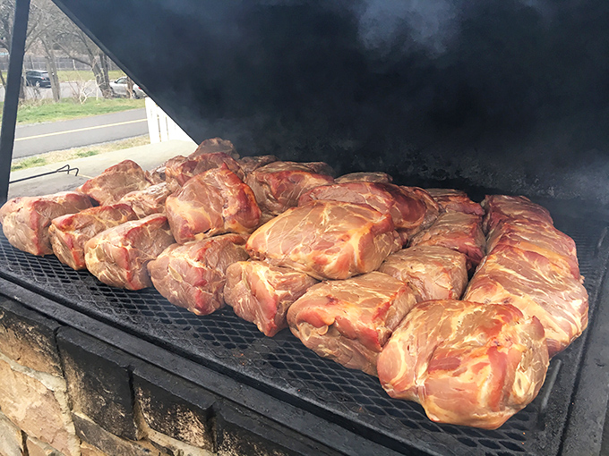 These pork butts aren't just smoking, they're undergoing a magical transformation into something that will haunt your dreams&mdash;in the best way.