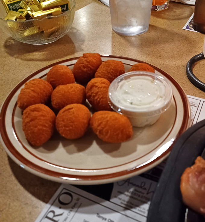 Golden-fried potato puffs with a side of nostalgia. Crispy outside, cloud-like inside&mdash;the supporting actors that steal scenes.