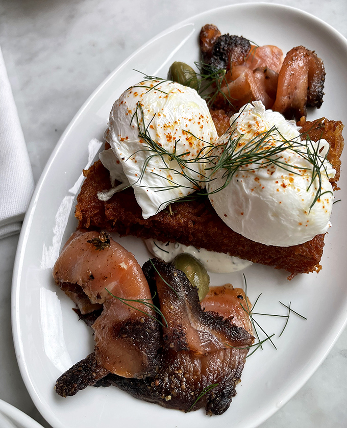 Poached eggs lounging atop smoked salmon and crispy potato r&ouml;sti&mdash;the breakfast equivalent of waking up in luxury sheets at a five-star hotel.