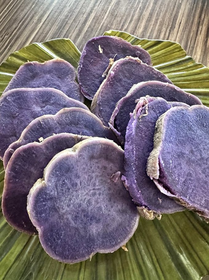 Purple sweet potato slices that look like they were harvested from some magical garden where vegetables actually taste like dessert.