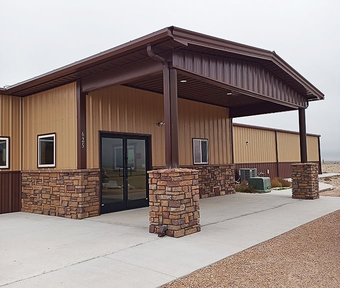The Prairie Hills Community Center welcomes visitors with stone pillars and practical architecture, a gathering place where function meets Wyoming's rugged aesthetic.