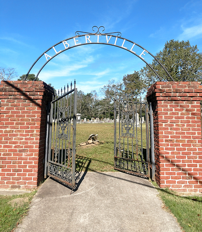 The Albertville Cemetery entrance stands as a dignified gateway to local history. Iron gates that have witnessed generations of stories.