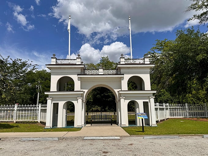 The elegant entrance to Radium Springs Gardens frames what was once a glamorous 1920s resort, now transformed into a peaceful botanical retreat.