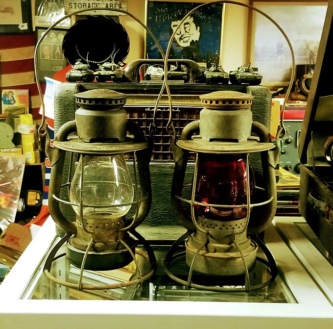 Railroad lanterns that once guided trains now illuminate the imagination. Perfect for adding authentic vintage charm to any modern space.