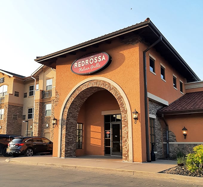 RedRossa Italian Grille brings Mediterranean flair to the prairie, its warm terracotta exterior promising pasta perfection inside.