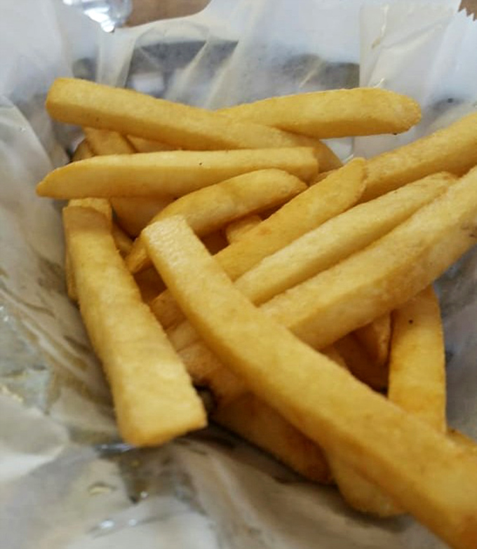 Fries that achieve the golden ratio of crispy exterior to fluffy interior. Simple, honest potato perfection that needs no fancy dipping sauce to shine.