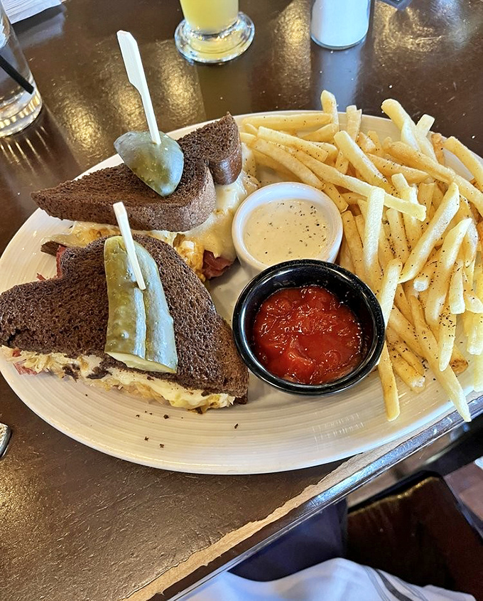 A sandwich that would make any New York deli proud, with crispy edges, melty cheese, and fries that deserve their own fan club.