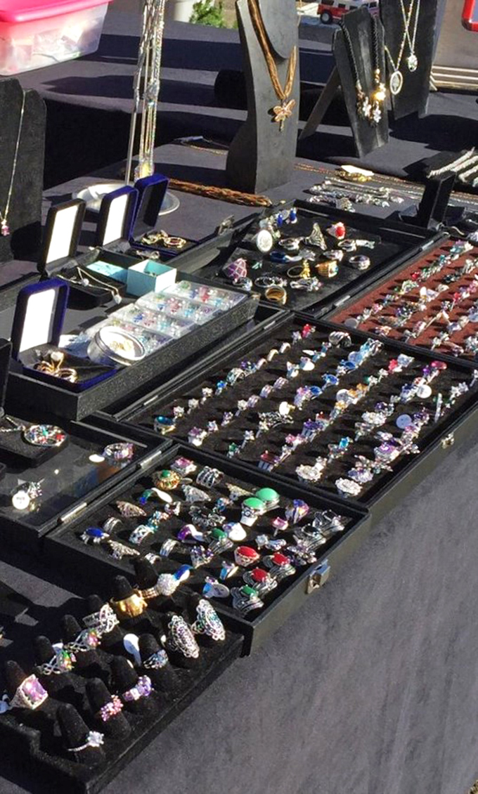 Treasure chests of rings and jewelry where "statement piece" meets "reasonable price" in a glittering display of possibilities.