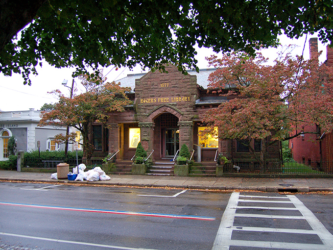 Rogers Free Library's stone fa&ccedil;ade and autumn-kissed trees create the perfect setting for literary discoveries on rainy afternoons.