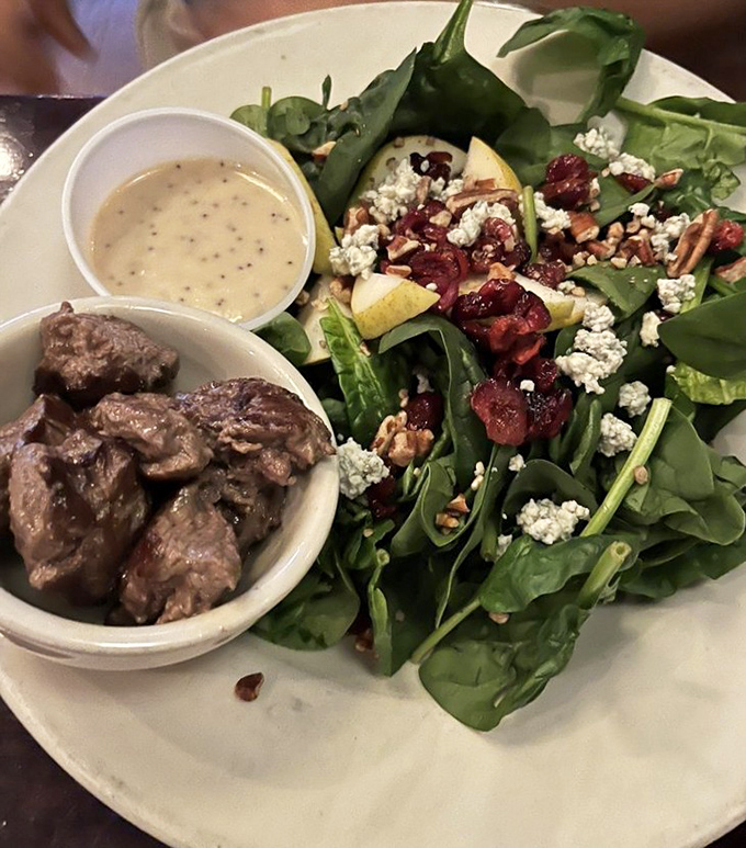 A salad that actually satisfies! Spinach, blue cheese, cranberries, and those perfectly seasoned beef tips&mdash;proof that "just a salad" can be the main event.